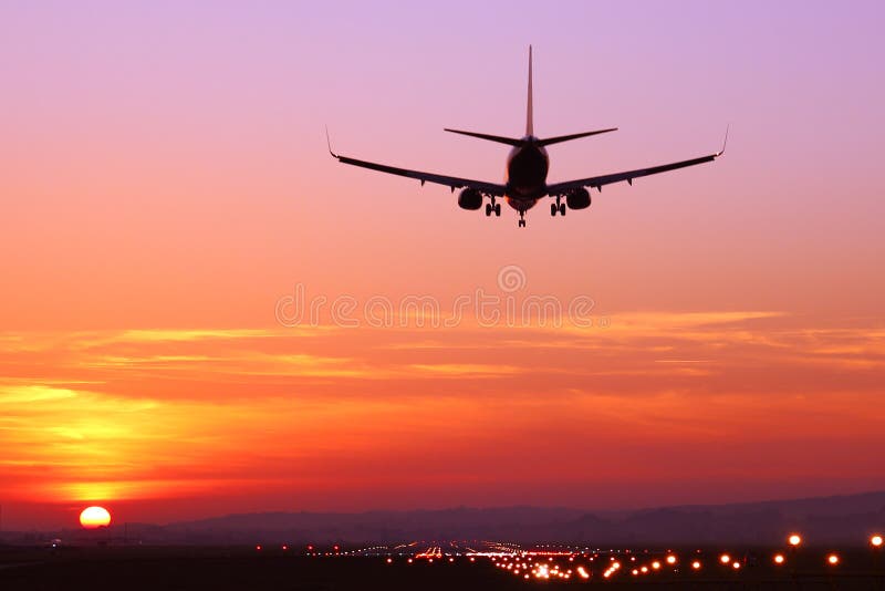 The Plane Lands at Dusk at Sunset Stock Image - Image of beautiful ...