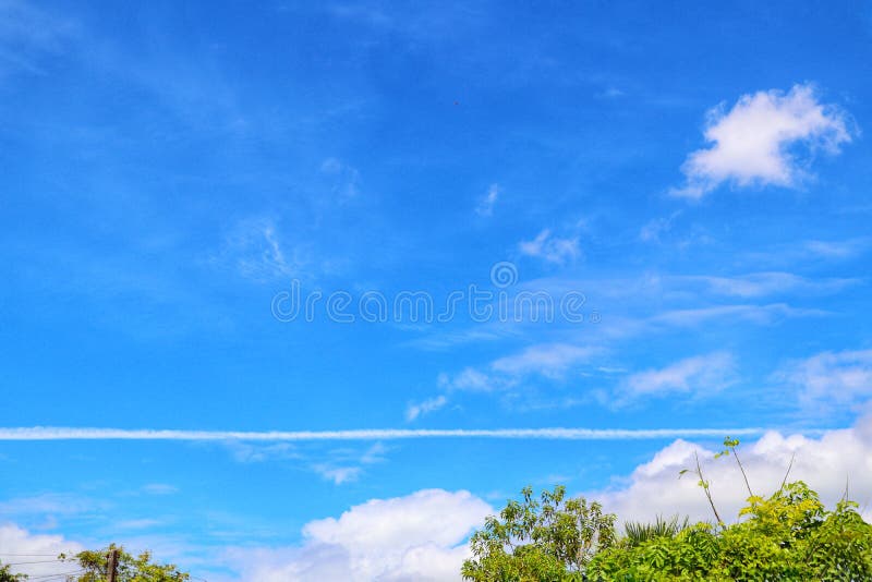 The Plane Leaves a Trace, Line Patterns, White Clouds in the Blue Sky ...