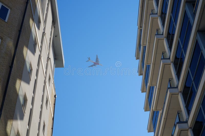 Plane between Two Buildings Stock Image - Image of plane, avaition ...