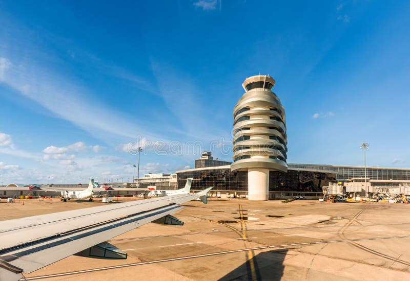 The Plane Makes Landing on the Runway Stock Image - Image of building ...