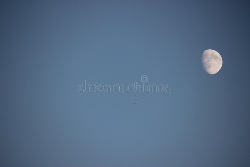 Plane, the moon in the sky stock image. Image of moon - 65288129