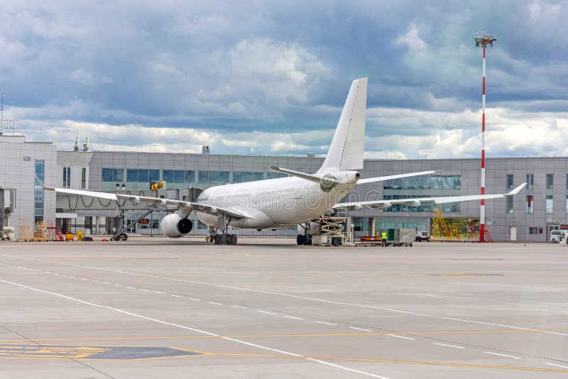 Plane Outside the Terminal Building Waiting for the Flight Stock Photo ...