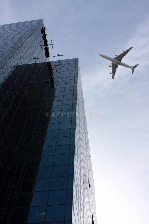Plane over a city stock photo. Image of plane, daytime - 14867578