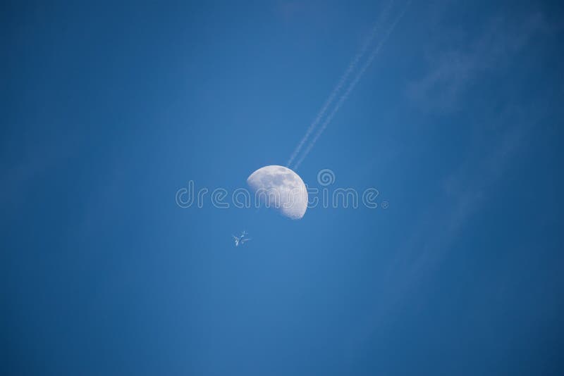 Plane Passing through the Moon from Bottom View with Long Condensation ...