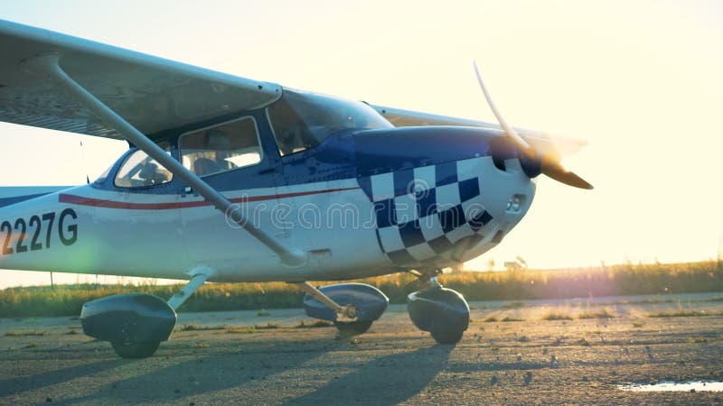 Airplane with Rotating Propeller. Working Plane Standing on a Runway ...