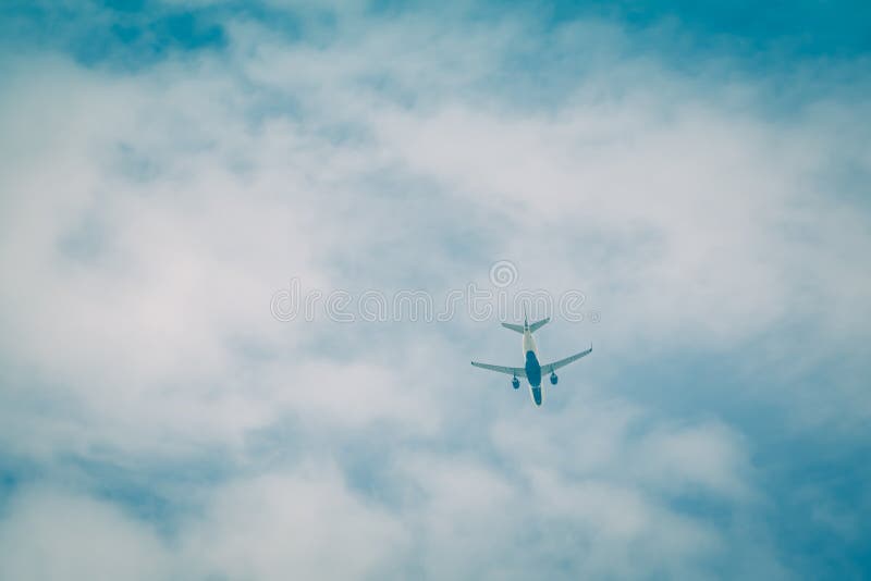 Plane Seen from the Distance in the Sky from Below Stock Photo - Image ...