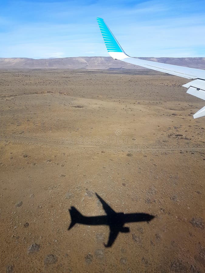 Plane shadow stock photo. Image of argentina, mountain - 77456888