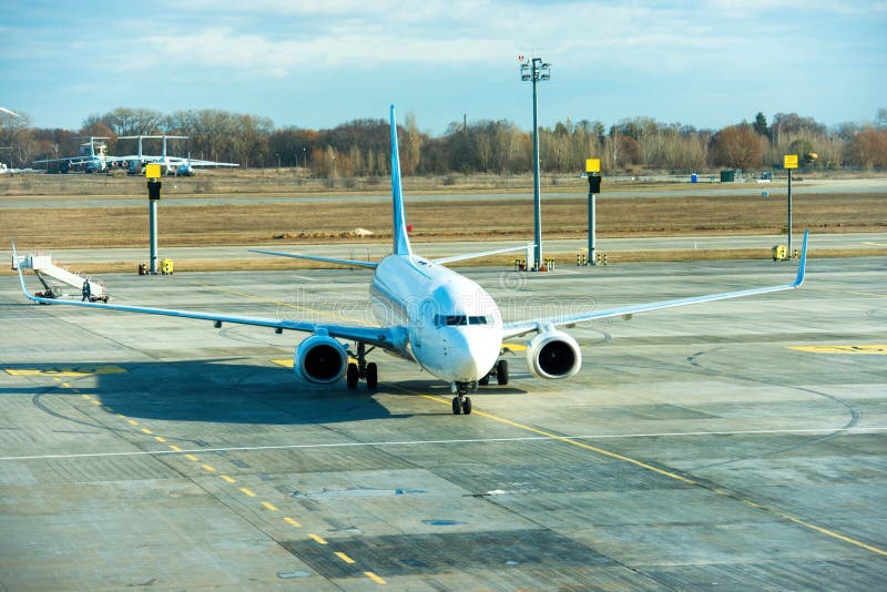 Plane standing on runway stock photo. Image of runway - 174775584