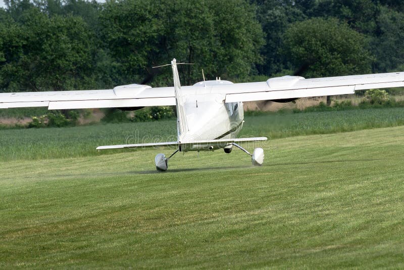 Plane Takeoff from a Grass Airport Stock Image - Image of tourism ...