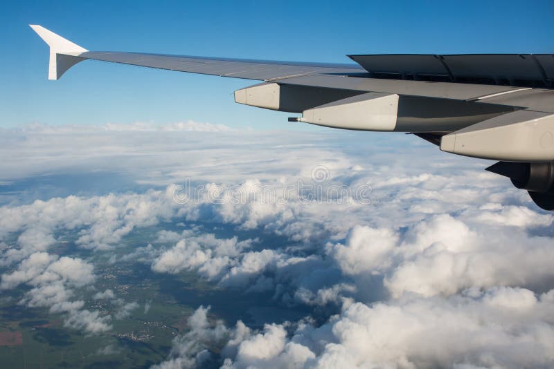 The Plane Takes Off Over the City. View of the Aircraft Wing. Stock ...