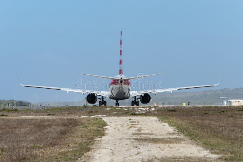 Rear View Of A Plane Taking Off From A Runway At An Airport Stock Image ...