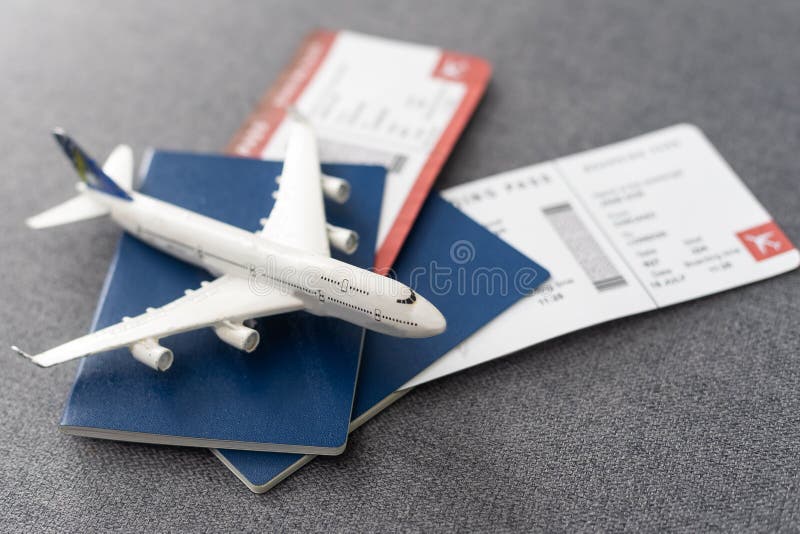 Plane Tickets, Passports and Toy Plane on Table Stock Photo - Image of ...