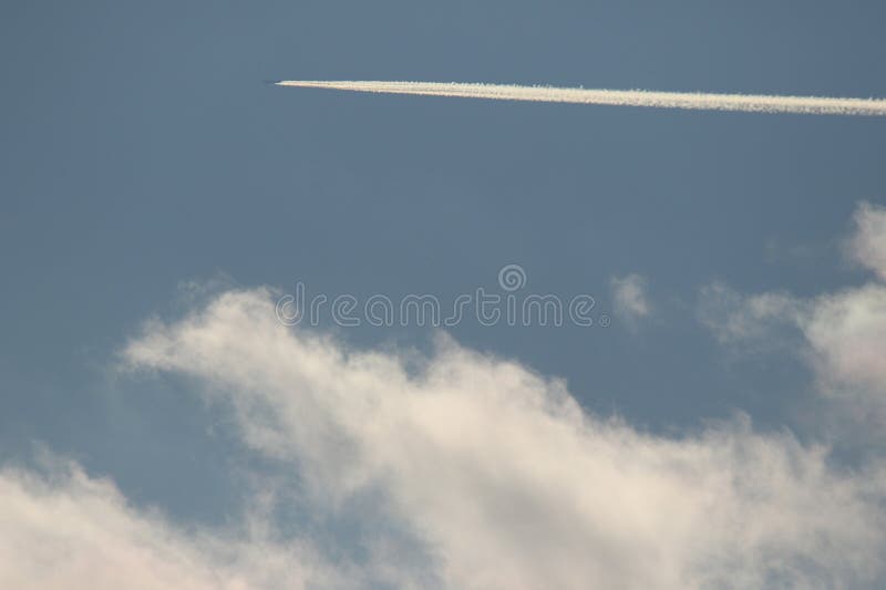 High Altitude Flying Airplane with Trail Cloud Stock Image - Image of ...