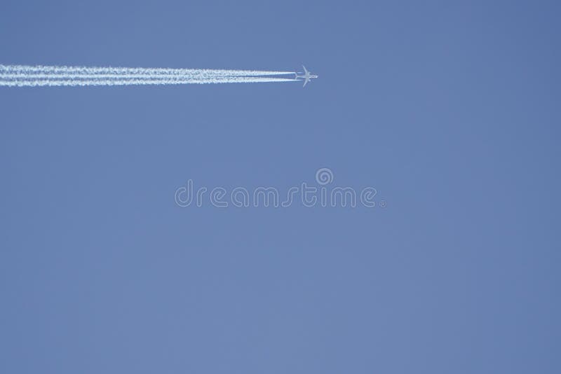 Plane with White Trail in Clear Sky. from the Left. Aviation in the Sky ...