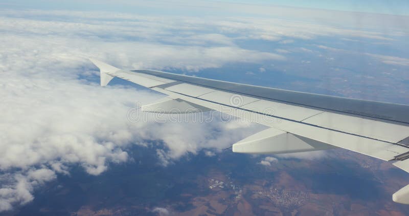 Flying on a Plane, View Over Wing Stock Footage - Video of cloudy ...