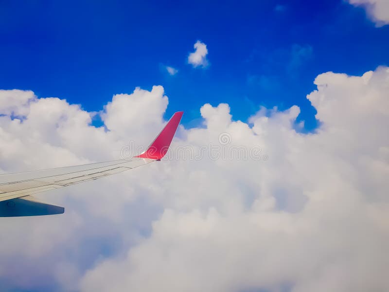 Plane Window View - View of Beautiful Clouds and Wing of Airplane from ...