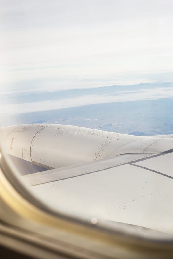 Plane Window View on Blue Sky, Clouds, Mountains. Scenes from an ...