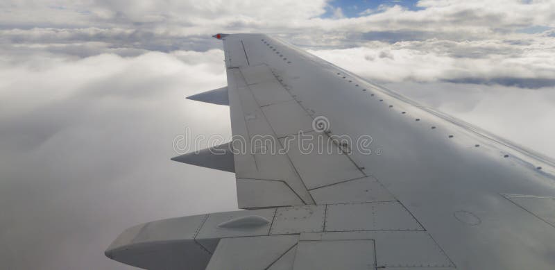 Plane wing and clouds stock image. Image of plane, commercial - 121723651