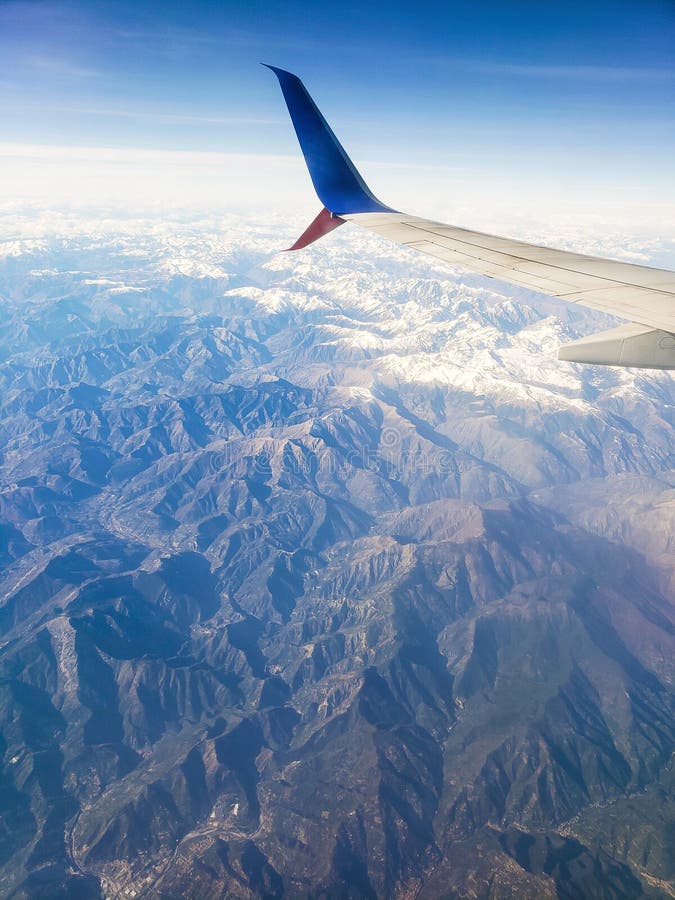 Plane Wing Snow Mountain View with Blue Sky. Photo from Flight Stock ...