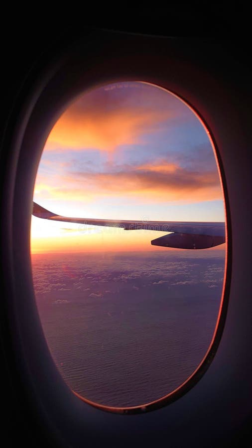 Plane Wing through the Window in a Sunset Editorial Stock Photo - Image ...