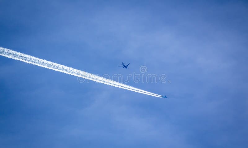 Planes cross in the sky stock photo. Image of bird, crash - 233276672