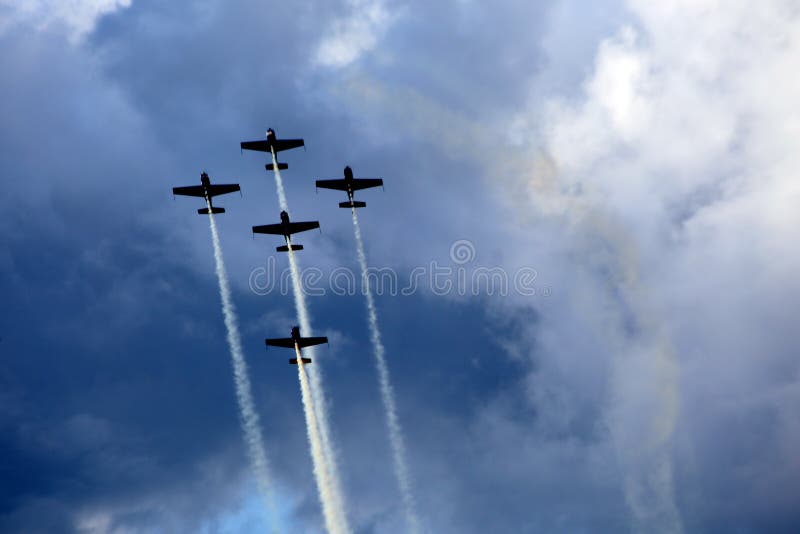 Planes Group in Acrobatic Flight Stock Image - Image of smoke, leader ...