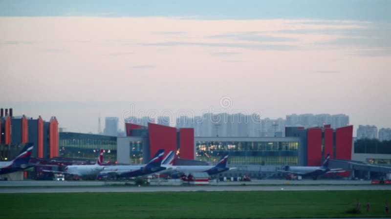 Planes Ride at Airport Terminal, Cityscape during Stock Video - Video ...