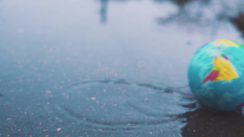 Planet Earth Beautiful Falls into a Muddy Puddle. Concept on ...