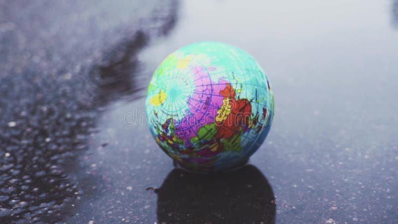 Planet Earth Beautiful Falls into a Muddy Puddle. Concept on ...