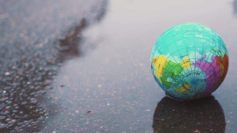 Planet Earth Beautiful Falls into a Muddy Puddle. Concept on ...