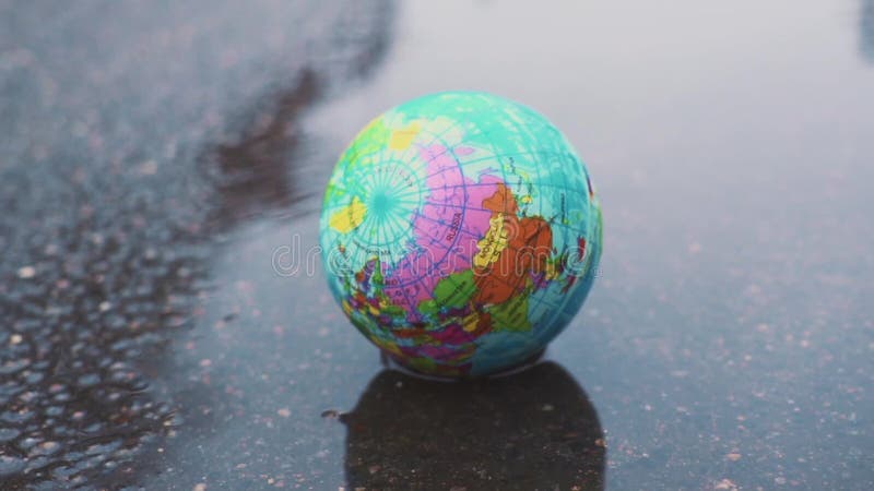 Planet Earth Beautiful Falls into a Muddy Puddle. Concept on ...