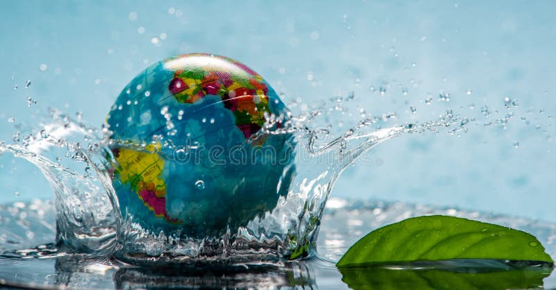Planet Earth in the Form of a Globe in Clear Water with Splashes ...