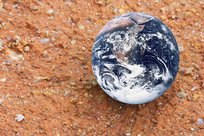 Planet Earth on Red Earth stock photo. Image of ecology - 13324312