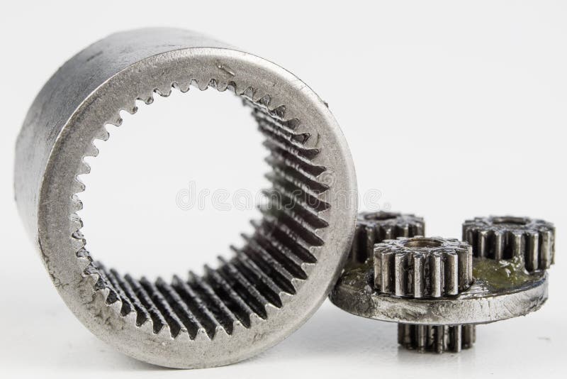 Planetary Gear from a Small Device on a Bright Table. Gear Wheel Stock ...