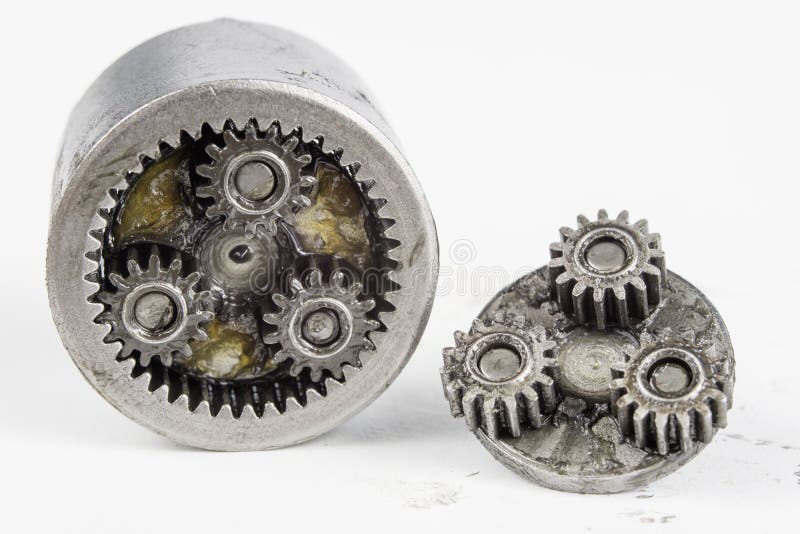 Planetary Gear from a Small Device on a Bright Table. Gear Wheel Stock ...