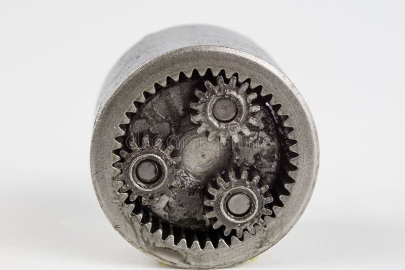 Planetary Gear from a Small Device on a Bright Table. Gear Wheel Stock ...