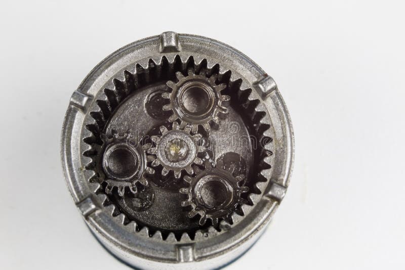 Planetary Gear from a Small Device on a Bright Table. Gear Wheel Stock ...