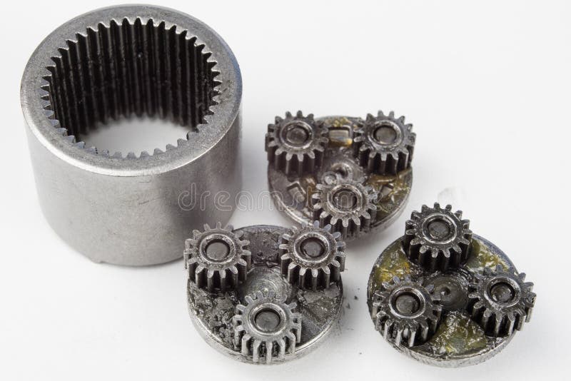 Planetary Gear from a Small Device on a Bright Table. Gear Wheel Stock ...