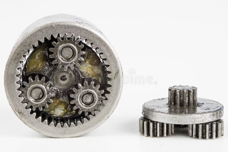 Planetary Gear from a Small Device on a Bright Table. Gear Wheel Stock ...