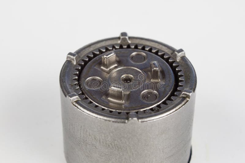 Planetary Gear from a Small Device on a Bright Table. Gear Wheel Stock ...
