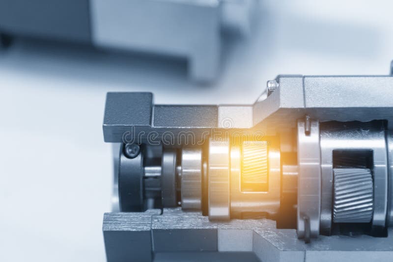 Planetary Gear from a Small Device on a Bright Table. Gear Wheel Stock ...