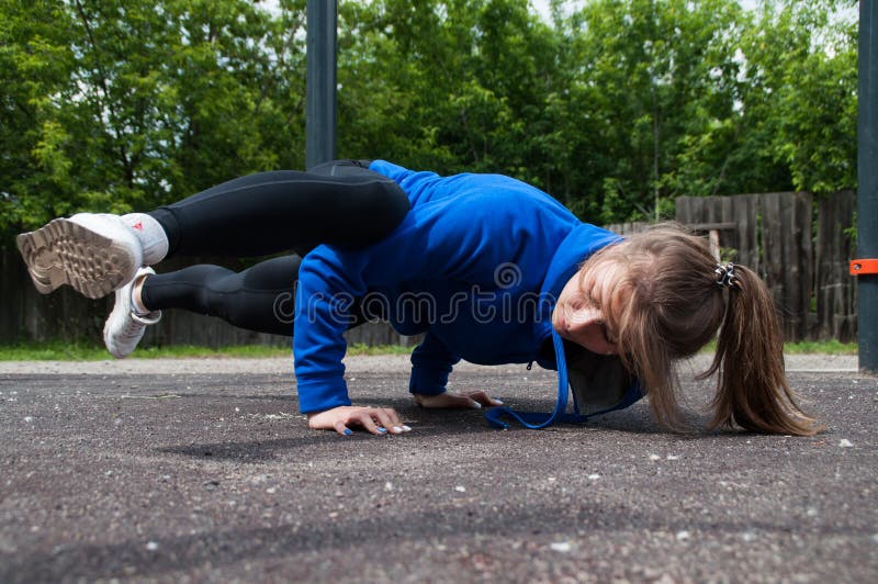 Plank on asphalt stock photo. Image of workout, hair - 74643046