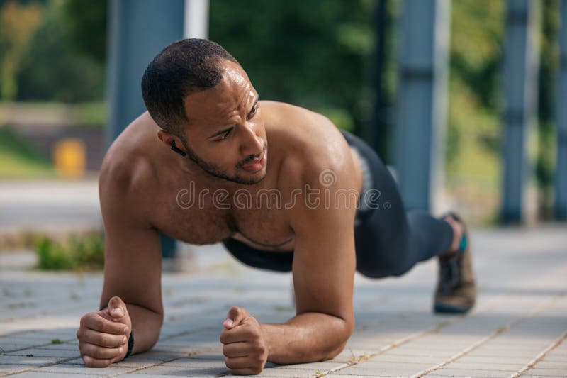 Young Well-built African American Man Standing in Plank Stock Photo ...