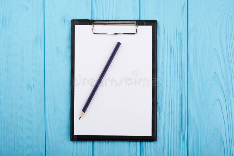 Planner on the Blue Wooden Working Table. Blank White Paper on Working ...