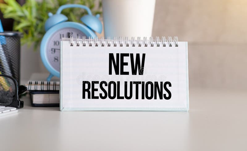 Daily Planner with the Entry New Resolutions on White Table Stock Image ...