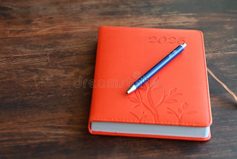 2025 Planner with Pen on Wooden Table. Stock Photo - Image of tool ...
