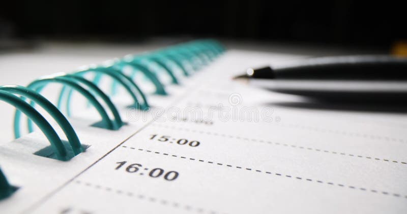 Daily Planner with Time Schedule by Clock and Ballpoint Pen Closeup ...