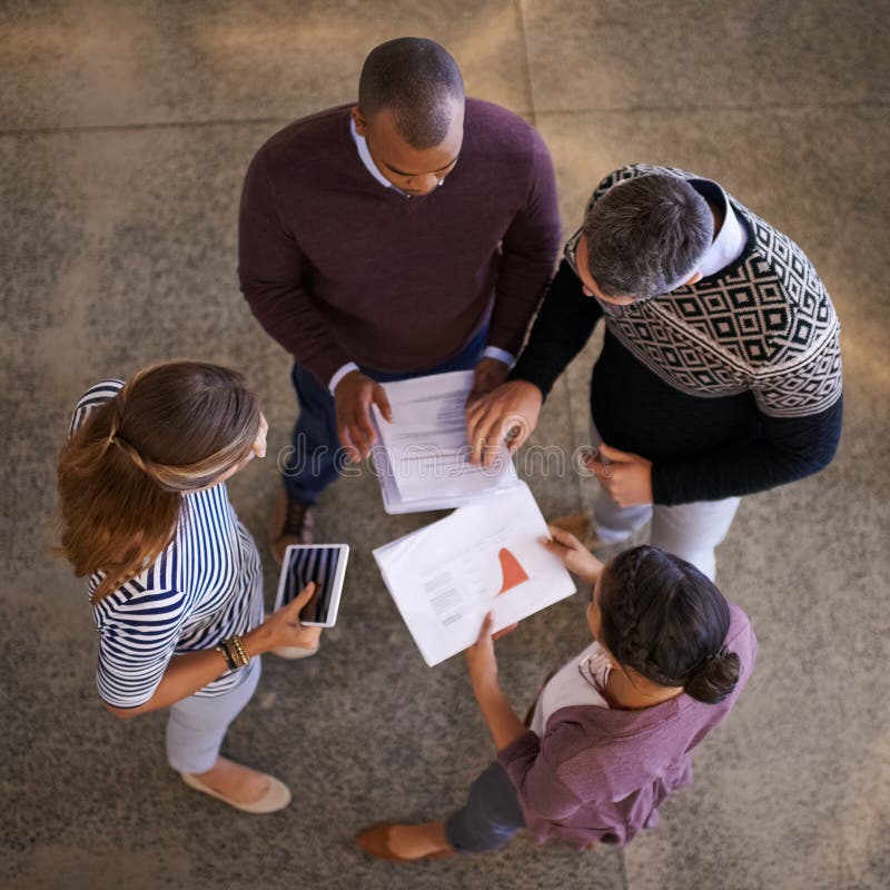 Planning Makes Perfect. High Angle Shot of a Group of Work Colleagues ...