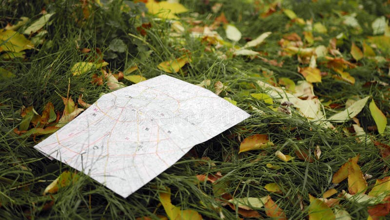 Paper Map Lay on the Ground in the Forest. Stock Photo - Image of ...