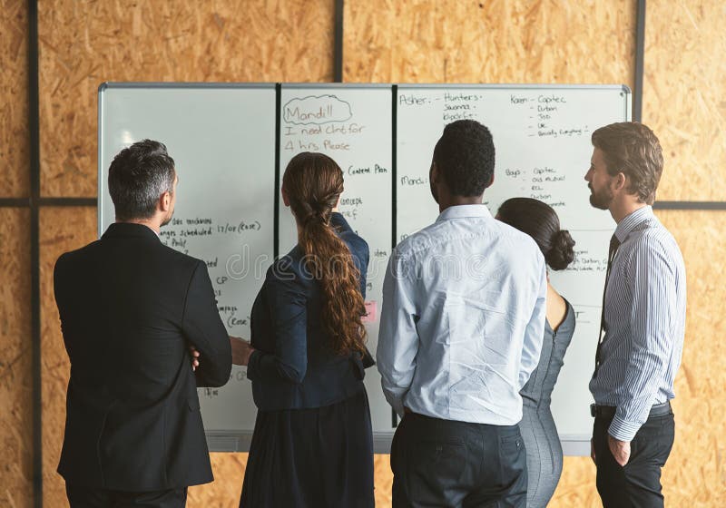 Planning the Way Forward. Rearview Shot of a Group of Businesspeople ...
